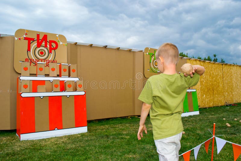 Kid Throwing Balls at a Target Stock Image - Image of green, game: 43681229