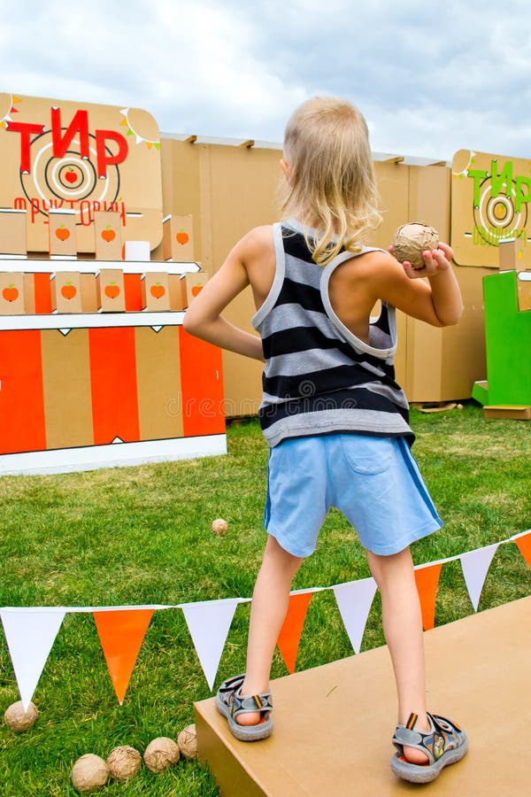 Kid Throwing Balls at a Target Stock Image - Image of color, accurately ...