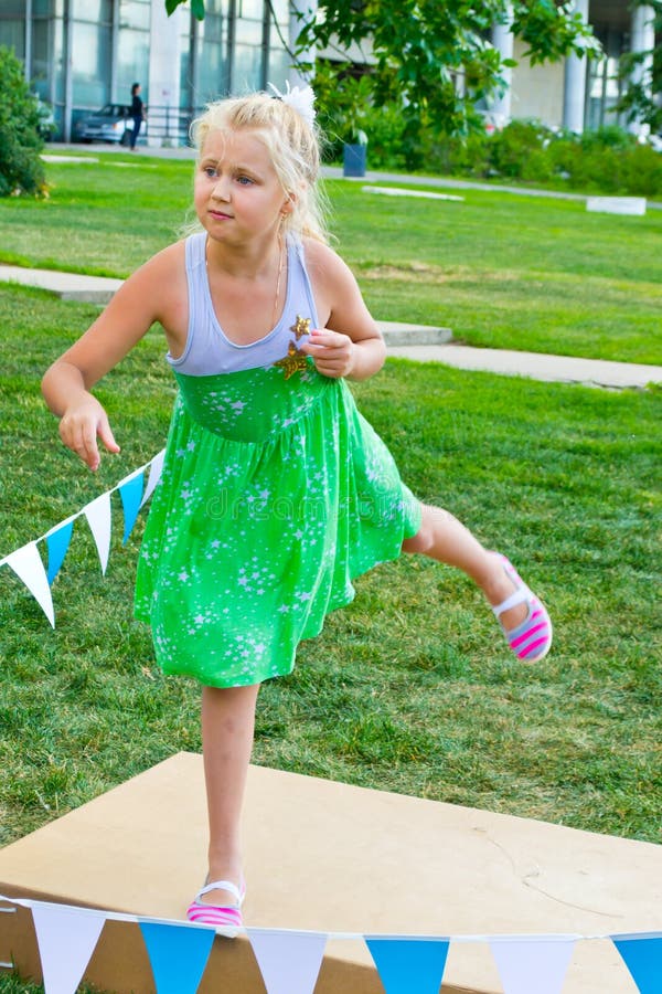 Kid Throwing Balls at a Target Stock Image - Image of blond, field ...