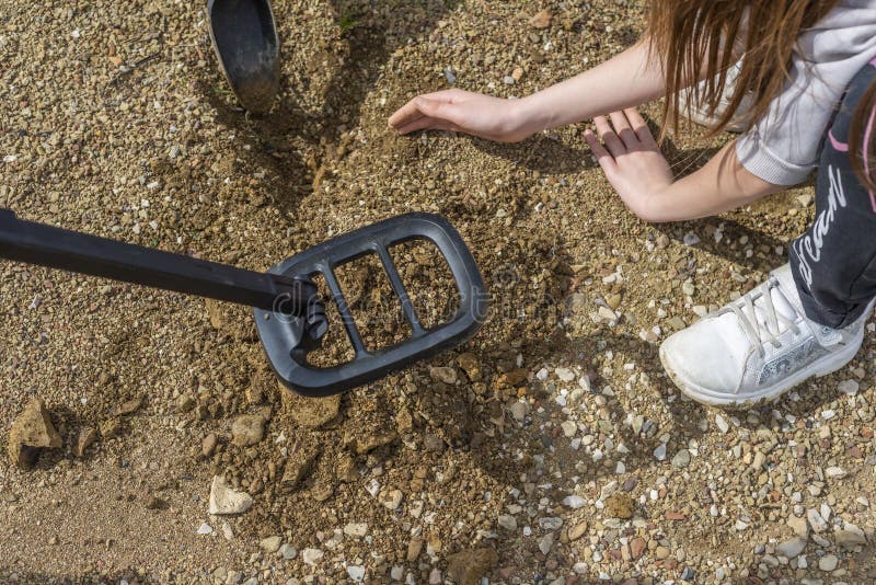 Kid Treasure Hunters Metal Detecting and Digging the Ground Stock Image ...