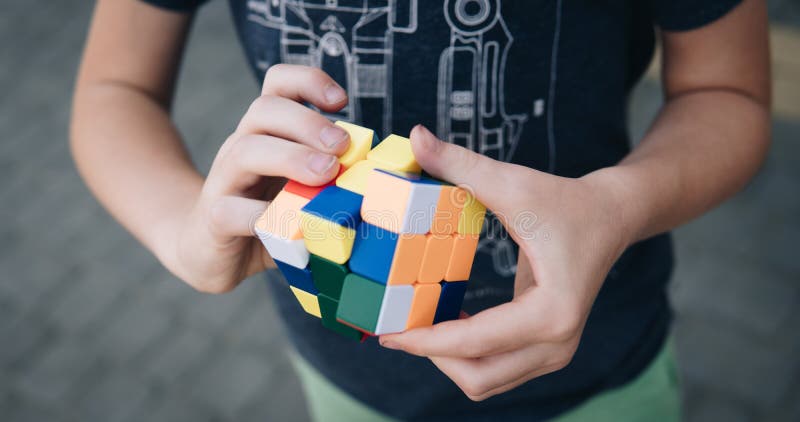 Kid holding rubik cube editorial image. Image of kids - 125698945