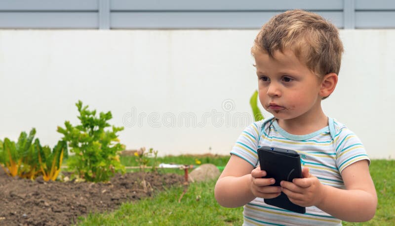 Kid Use Cellphone in the Park Stock Photo - Image of technology, little ...