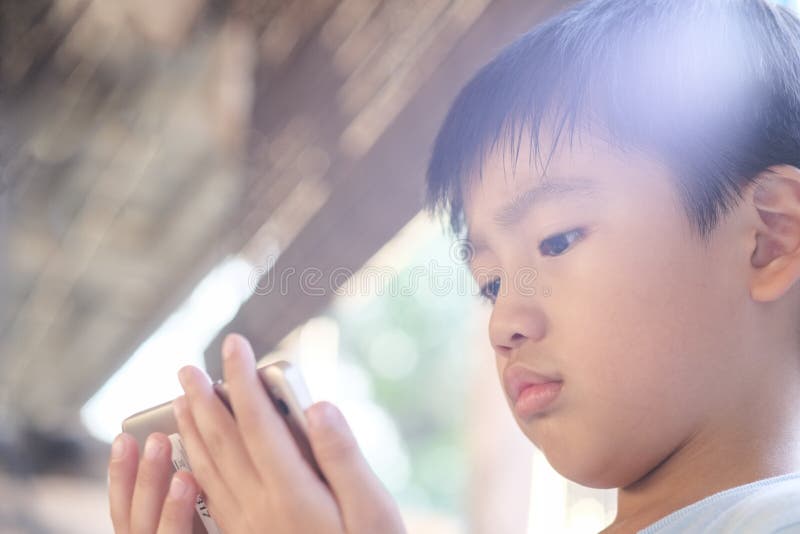 Kid using mobile phone stock image. Image of childhood - 91227123