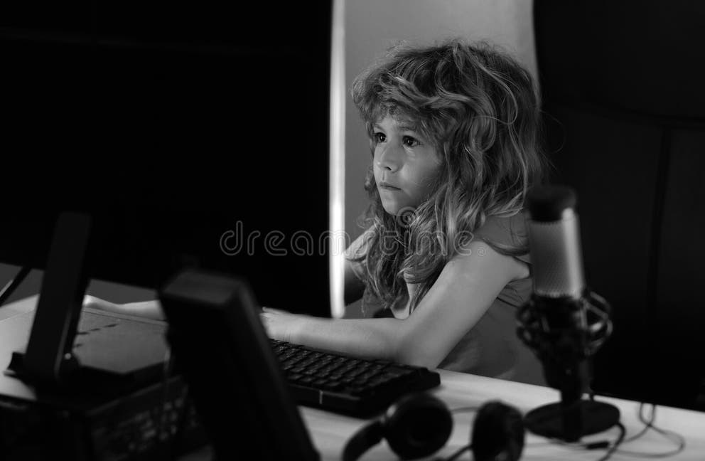 Kid Using Pc at Night. Child with Computer in a Dark Room. Stock Photo ...