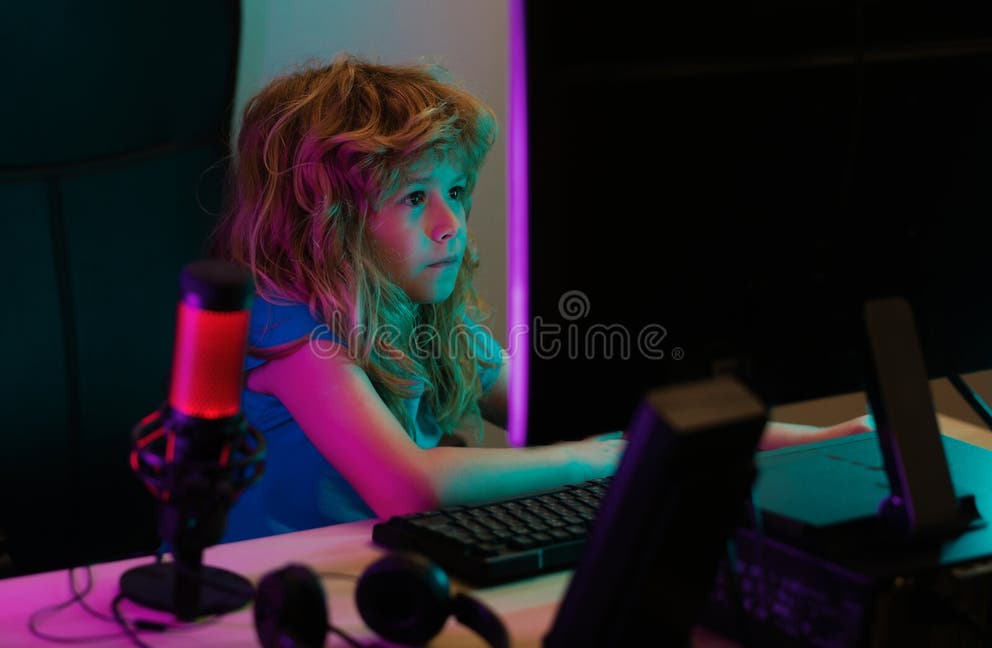 Kid Using Pc at Night. Child with Computer in a Dark Room. Stock Photo ...