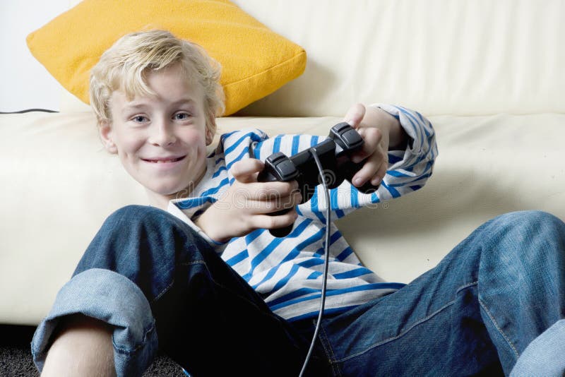 Kid Using Playstation Controls at Home. Stock Image - Image of energy ...