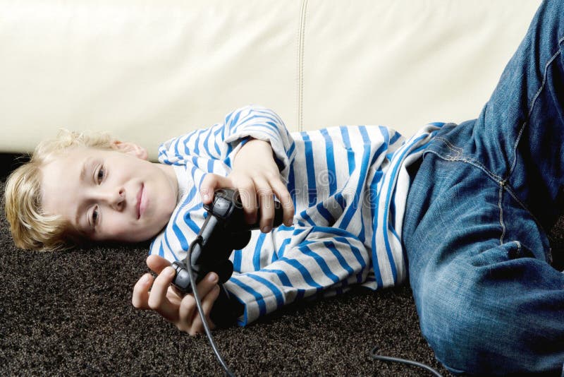 Kid Using Playstation Controls at Home. Stock Image - Image of energy ...