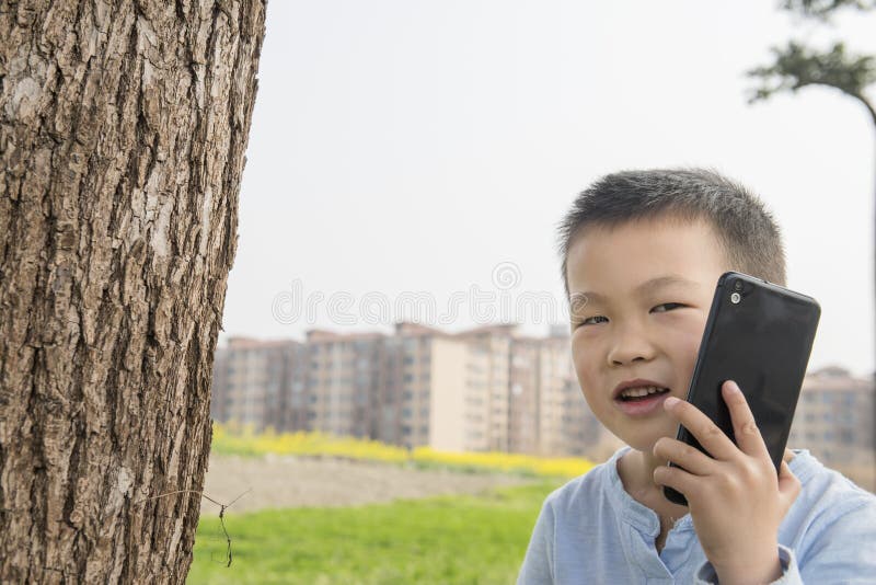 Kid using smartphone stock image. Image of smartphone - 68734693