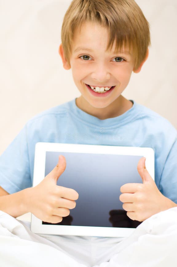 Kid using tablet computer stock photo. Image of game - 35277656