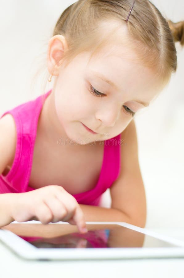 Kid using tablet computer stock image. Image of game - 33648981