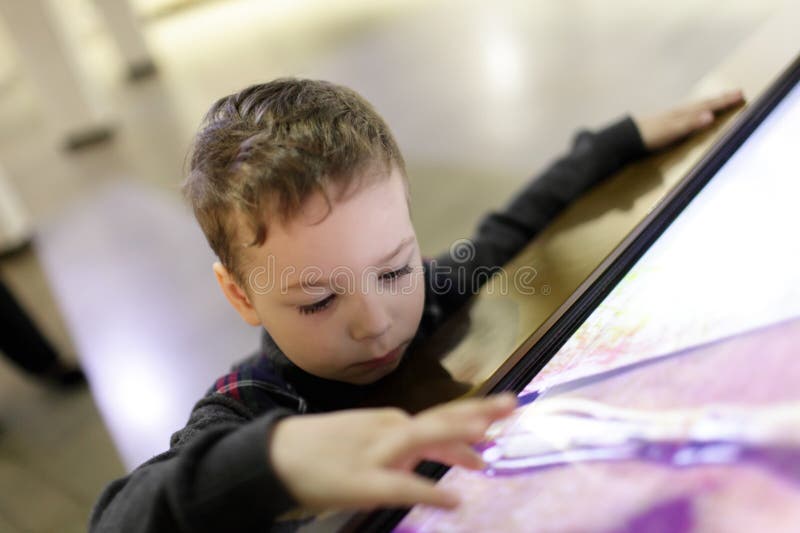 Kid using touch screen stock photo. Image of device, hobby - 53622532