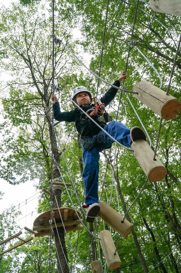 Kid Walking on a Logs Path in Adventure Park Stock Photo - Image of ...