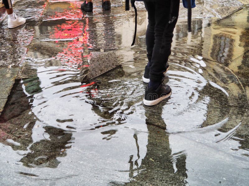 Kid Walking in the Puddle of Water after the Rainstorm Stock Image ...