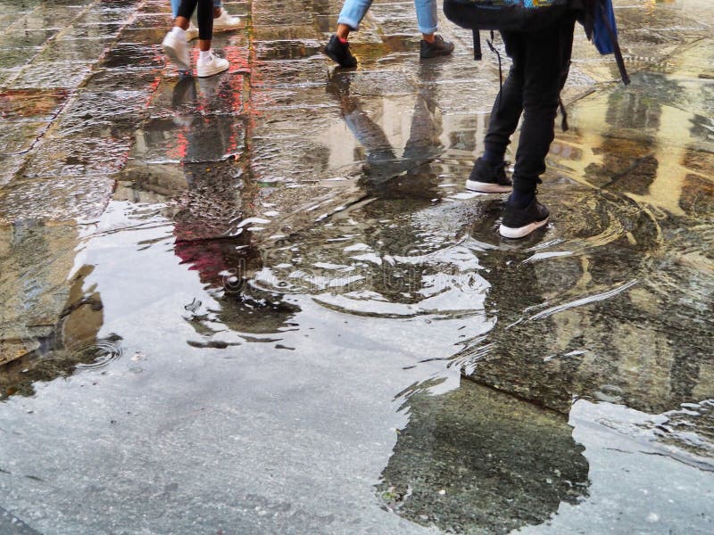 Kid Walking in the Puddle of Water after the Rainstorm Stock Image ...