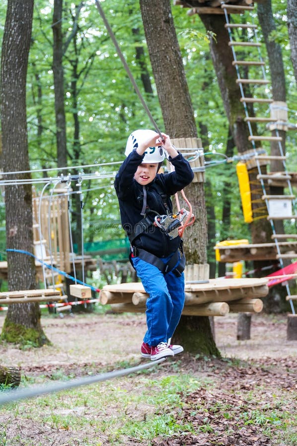 Kid Walking on a Wire in Adventure Park Stock Photo - Image of ...