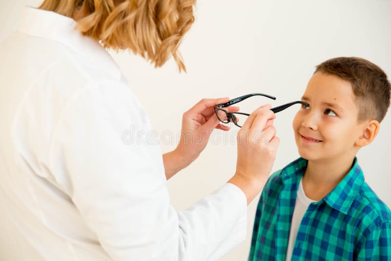 Kid wearing glasses stock image. Image of candid, cheerful - 112972345