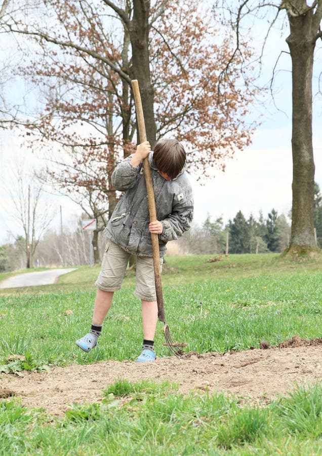 Kid working on the field stock image. Image of working - 52851693