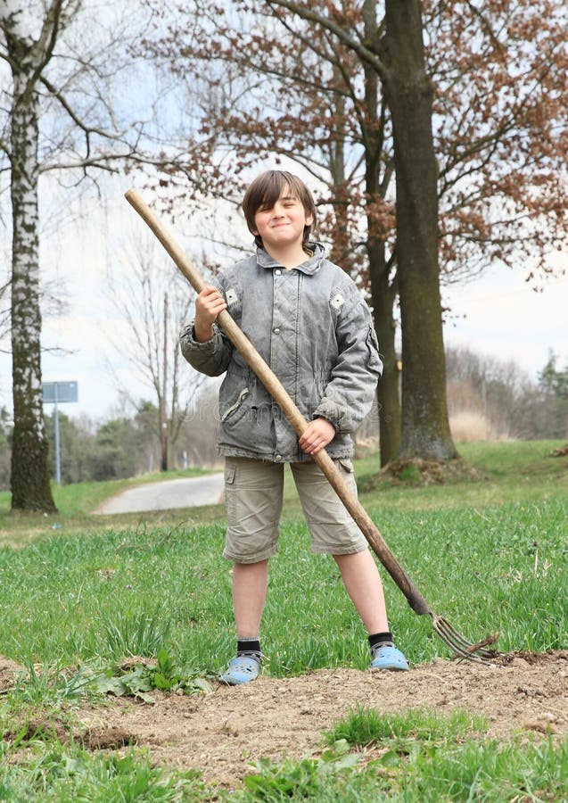 Kid working on the field stock image. Image of working - 52851693
