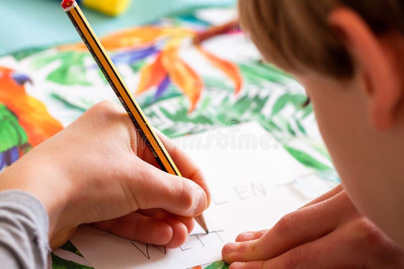 Kid Writing on Paper - Homework during the Covid 19 Pandemic Stock ...