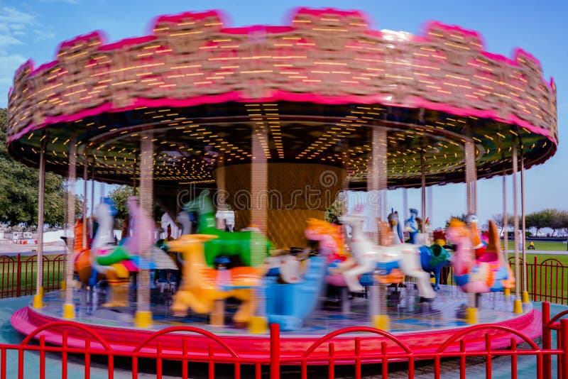 Kiddie Carousel Ride for Kids in the Park during Sunset Stock Photo ...