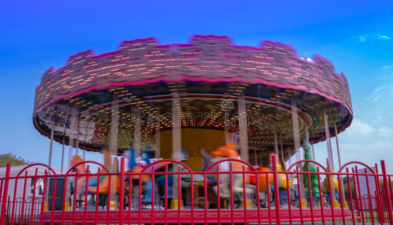 Kiddie Carousel Ride for Kids in the Park during Sunset Stock Photo ...
