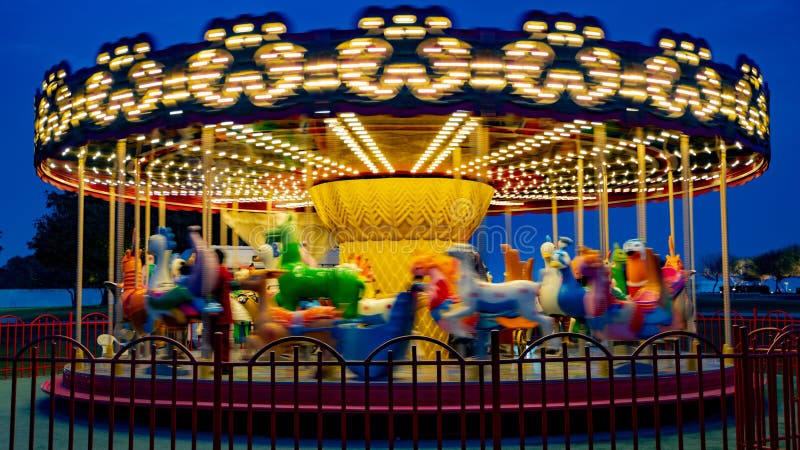 Kiddie Carousel Ride for Kids in the Park during Sunset Stock Photo ...