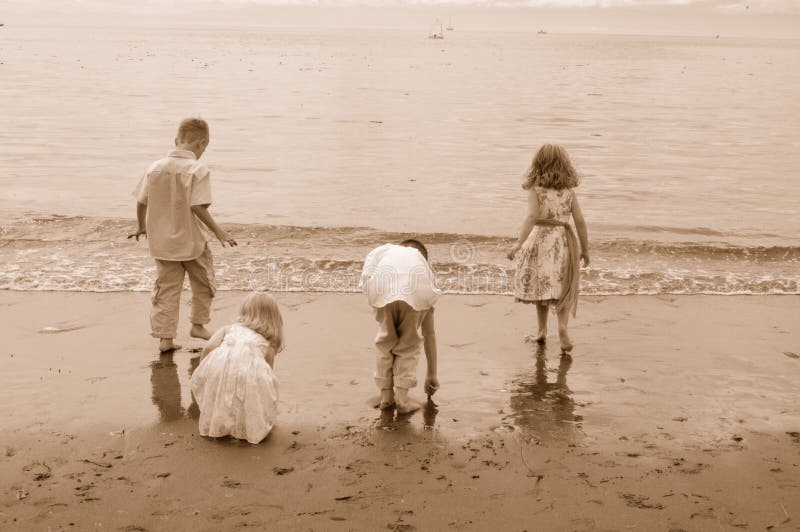Kids at the Beach 2 stock photo. Image of clouds, beach - 1059326