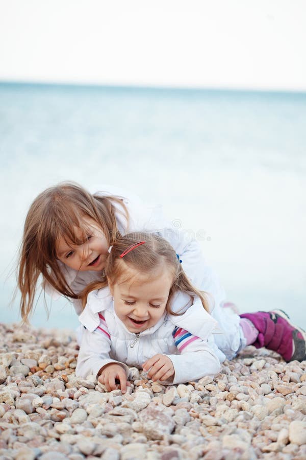 Kids at the beach stock photo. Image of lifestyle, cold - 24549644