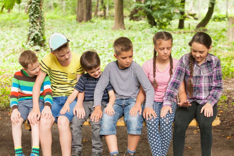 Kids on the bench stock photo. Image of girl, female - 107948912