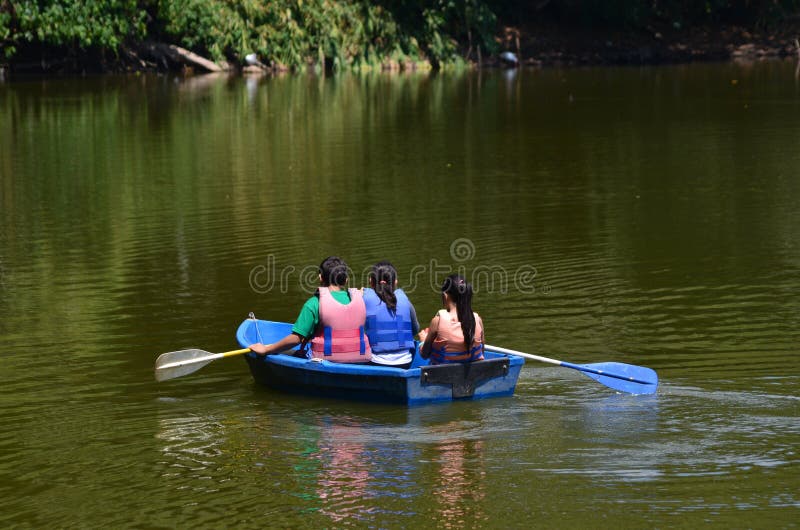Kids Rowing Boat in a Lake in Ecuador Editorial Stock Photo - Image of ...