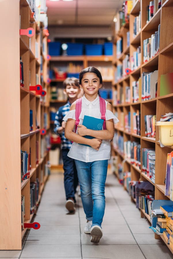 Adorable Kids with Books Walking Stock Image - Image of library ...