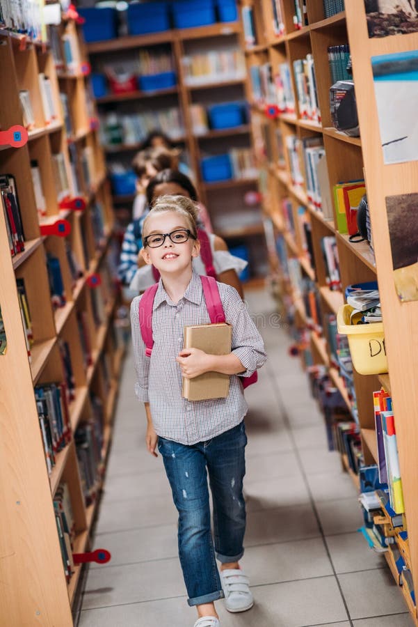 Adorable Kids with Books Walking Stock Photo - Image of books, research ...
