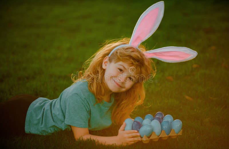 Kids Boy in Rabbit Costume with Bunny Ears Hunting Easter Eggs. Easter ...