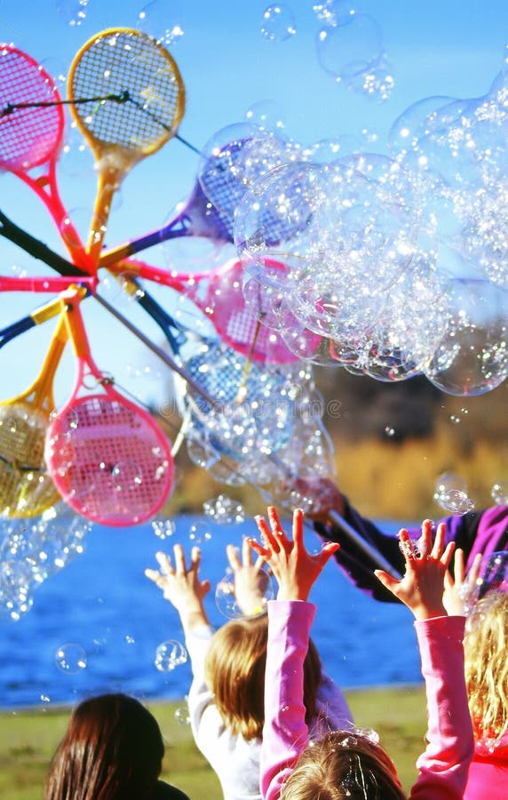Kids Catching Bubbles Outdoors. Stock Image - Image of kids, colors ...