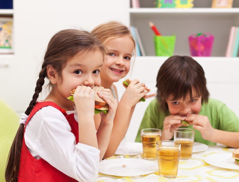 Kids Chomping on Sandwiches Stock Photo - Image of head, lifestyle ...