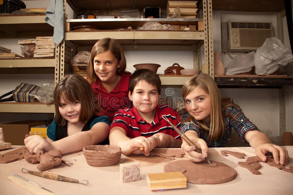 Kids in a clay studio stock photo. Image of young, roll - 13279856