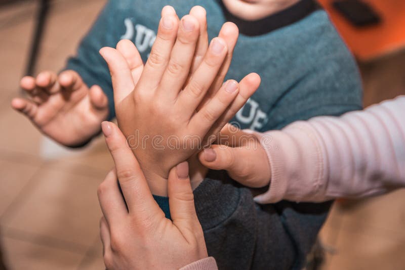 Comparing hand sizes stock image. Image of love, older - 156442603