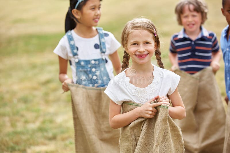 Kids Competing at Sack Race Stock Photo - Image of birthday ...