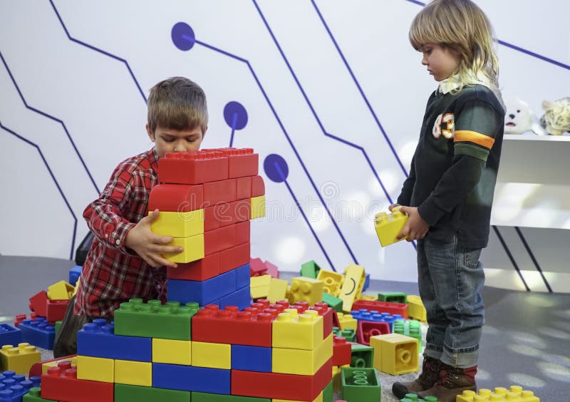 Kids Constructing a Man from the Building Blocks Stock Photo - Image of ...