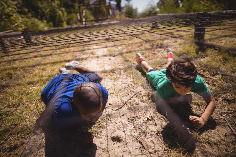 Kids Crawling Under the Net during Obstacle Course Training Stock Image ...