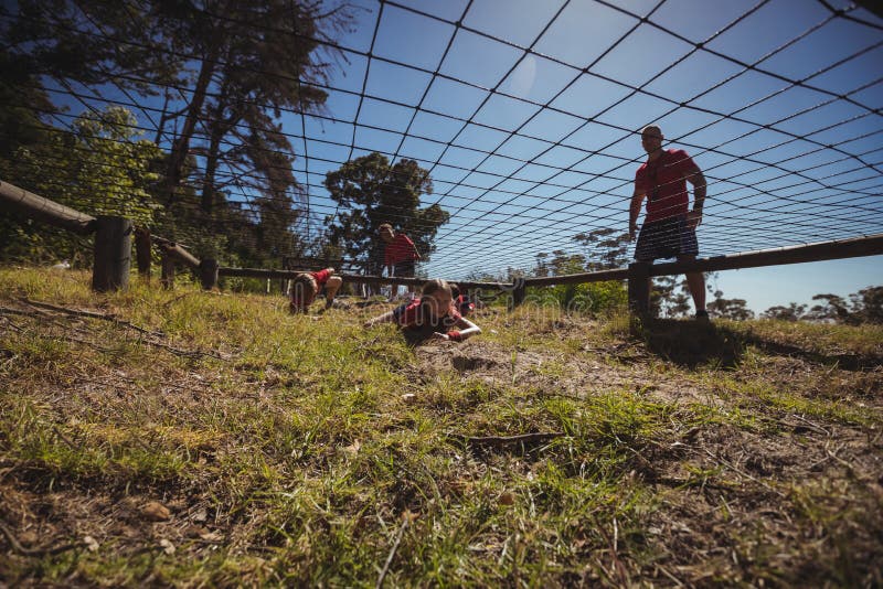 Kids Crawling Under the Net during Obstacle Course Training Stock Image ...