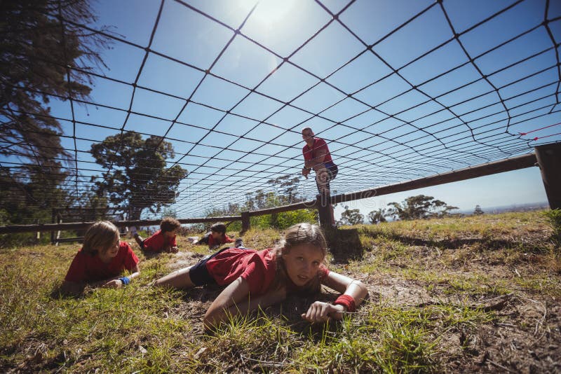 Kids Crawling Under the Net during Obstacle Course Training Stock Image ...