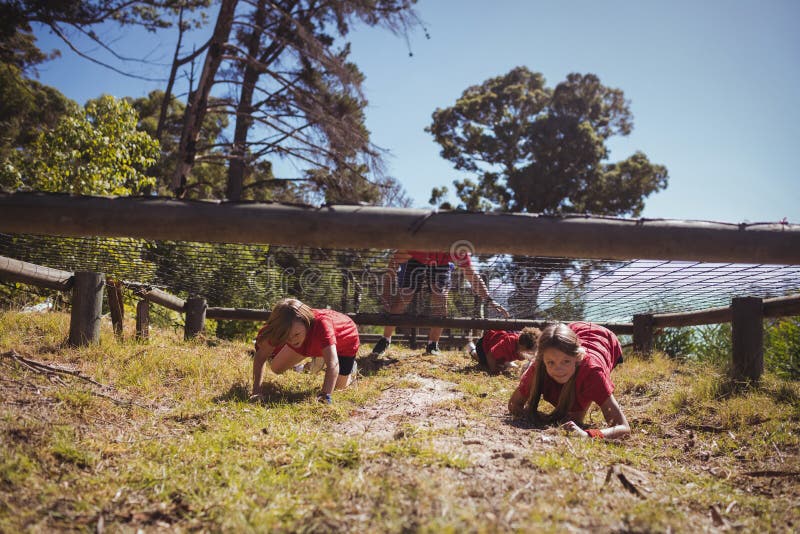 Kids Crawling Under the Net during Obstacle Course Training Stock Image ...