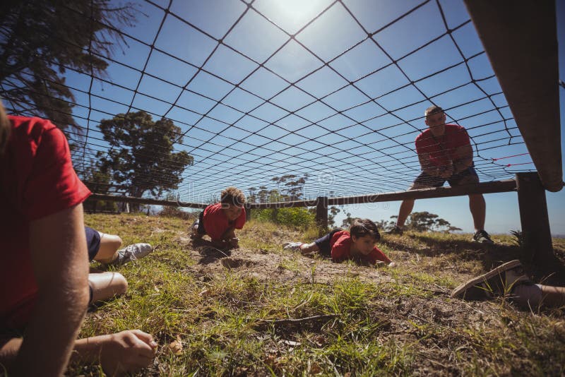 Kids Crawling Under the Net during Obstacle Course Training Stock Image ...