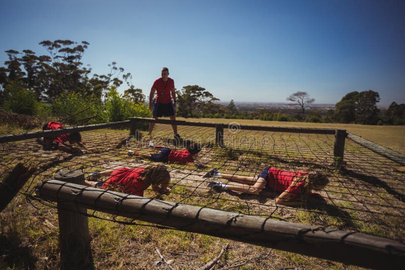 Kids Crawling Under the Net during Obstacle Course Training Stock Image ...
