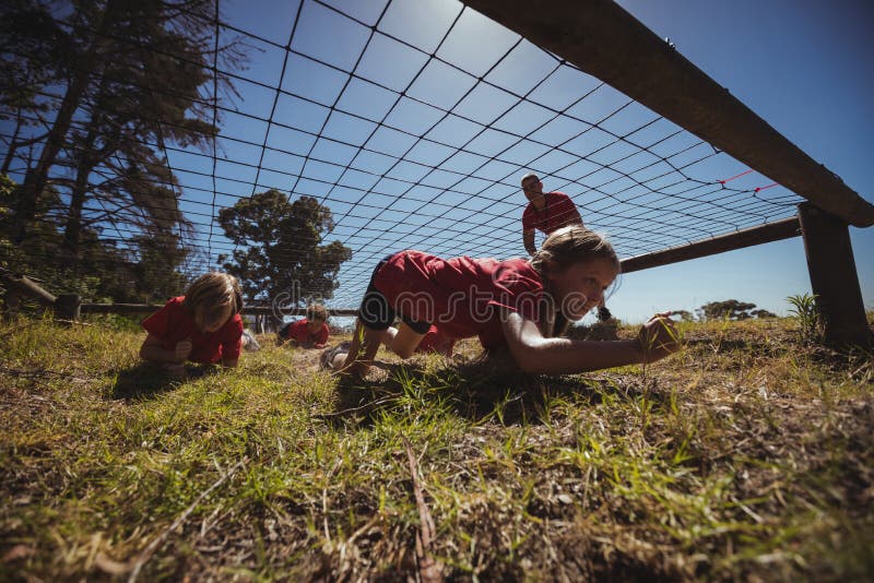 Kids Crawling Under the Net during Obstacle Course Training Stock Photo ...
