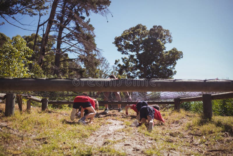 Kids Crawling Under the Net during Obstacle Course Training Stock Image ...