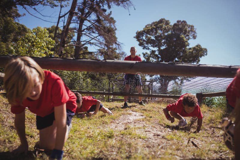 Kids Crawling Under the Net during Obstacle Course Training Stock Image ...