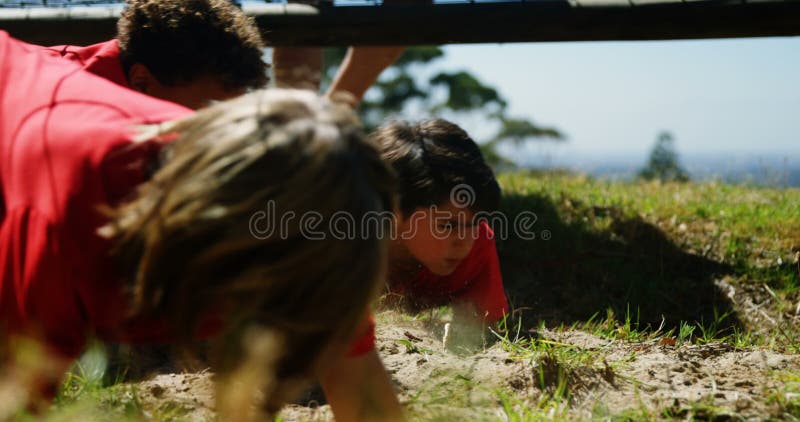 Kids Crawling Under the Net during Obstacle Course Training Stock ...
