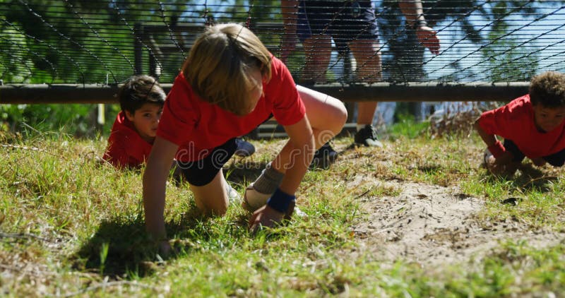 Kids Crawling Under the Net during Obstacle Course Training Stock ...